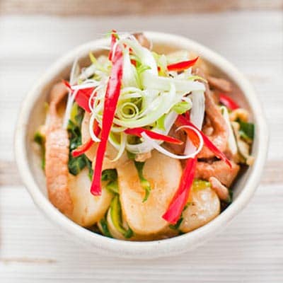 Delicious savoury Stir Fried Rice Cake with Spring Greens and Pork recipe